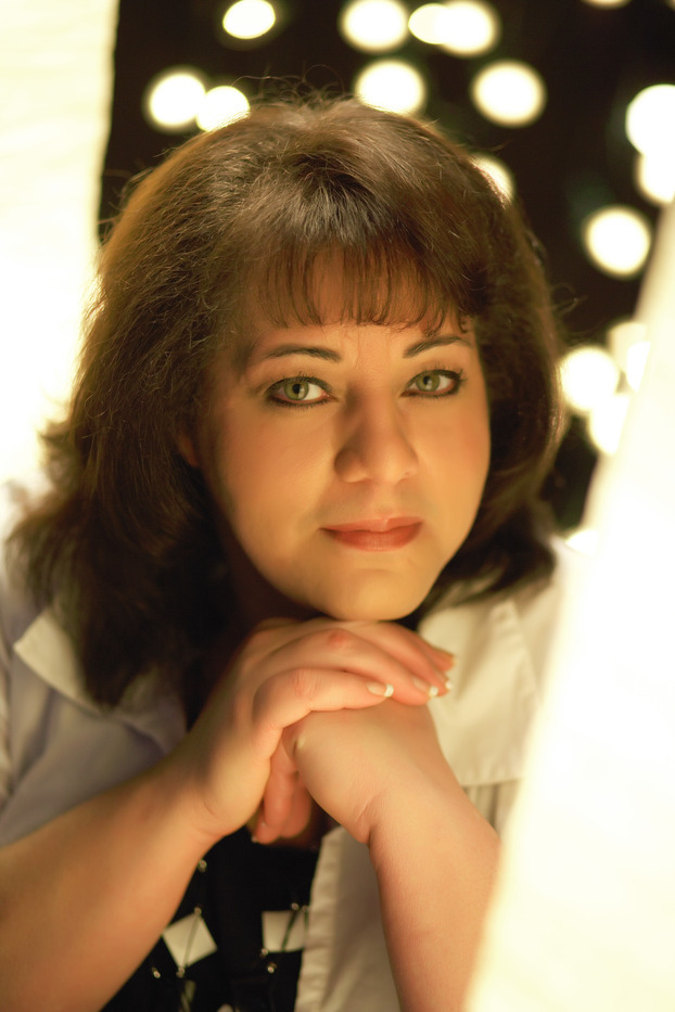 T.L. Mitchell (Author of Dark of kNight)