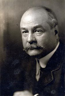 Quote by Nicholas Butler: “An expert is one who knows more and more ...