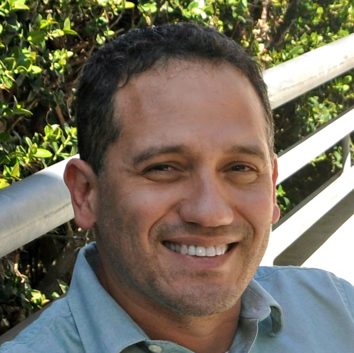 Ernesto Cisneros (Author of Efrén Divided)